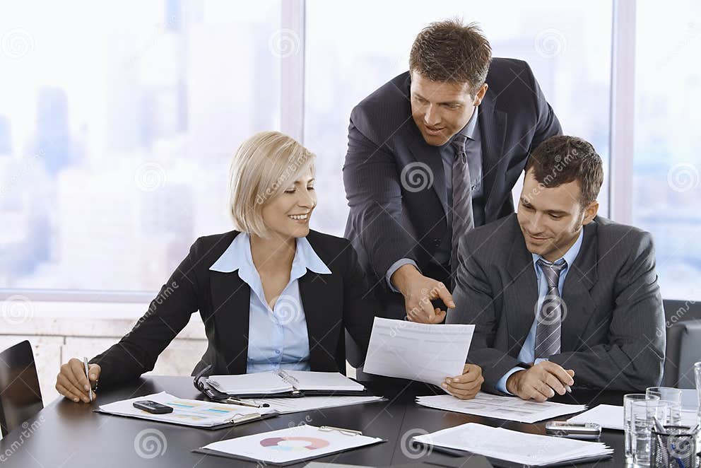 Business People Reviewing Documents Stock Photo - Image of businessman ...