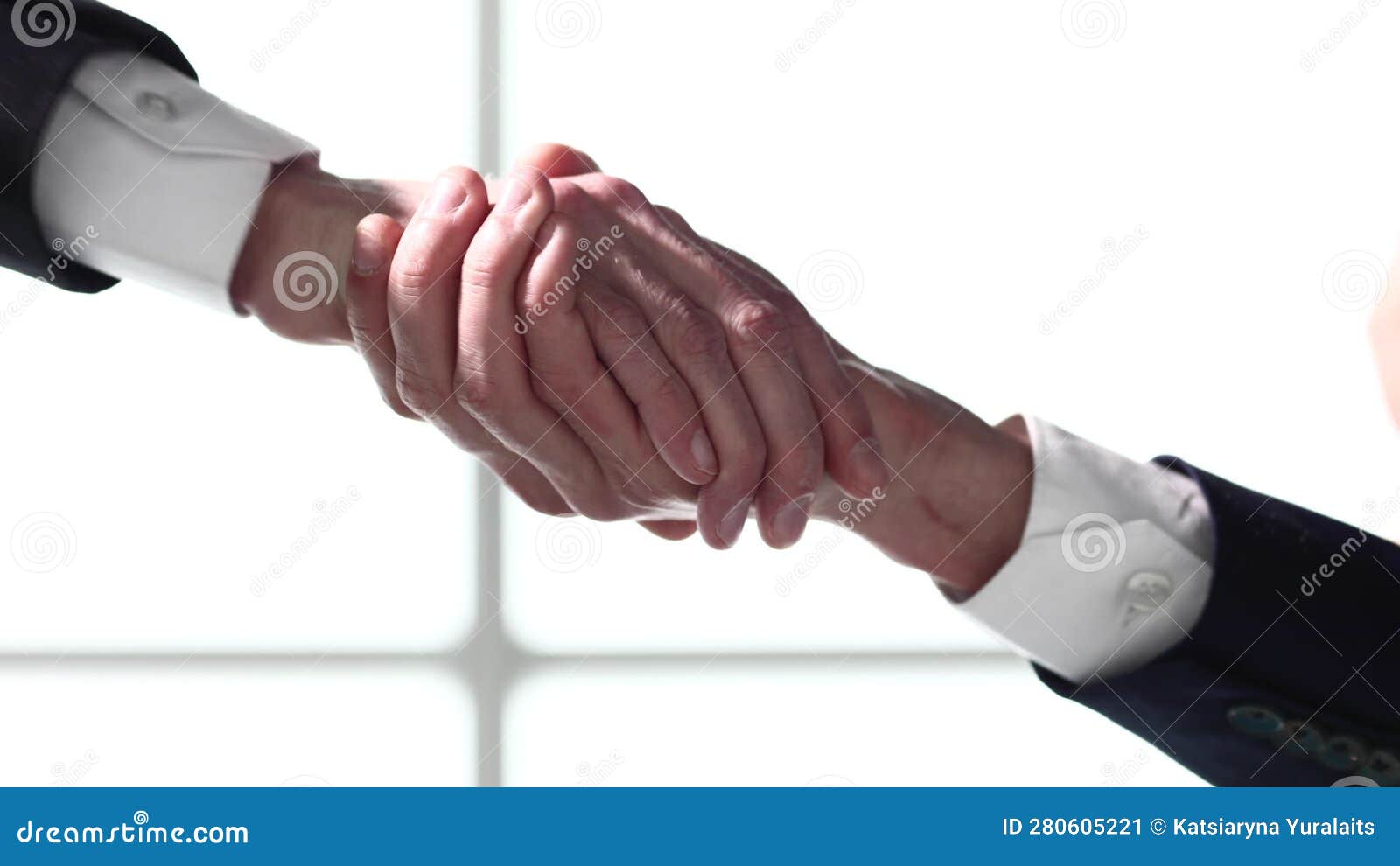 Foreground of Handshake in Front of the Window of the Office Stock ...