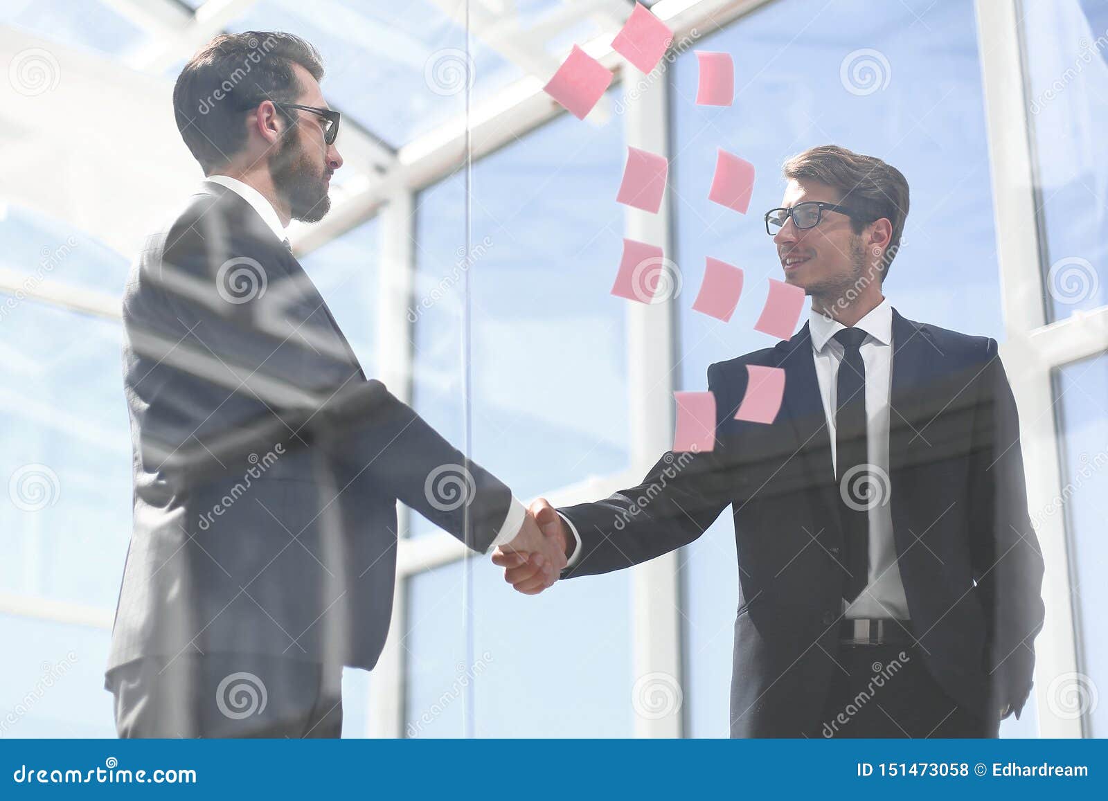Business People Shaking Hands in a Modern Office Stock Photo - Image of ...