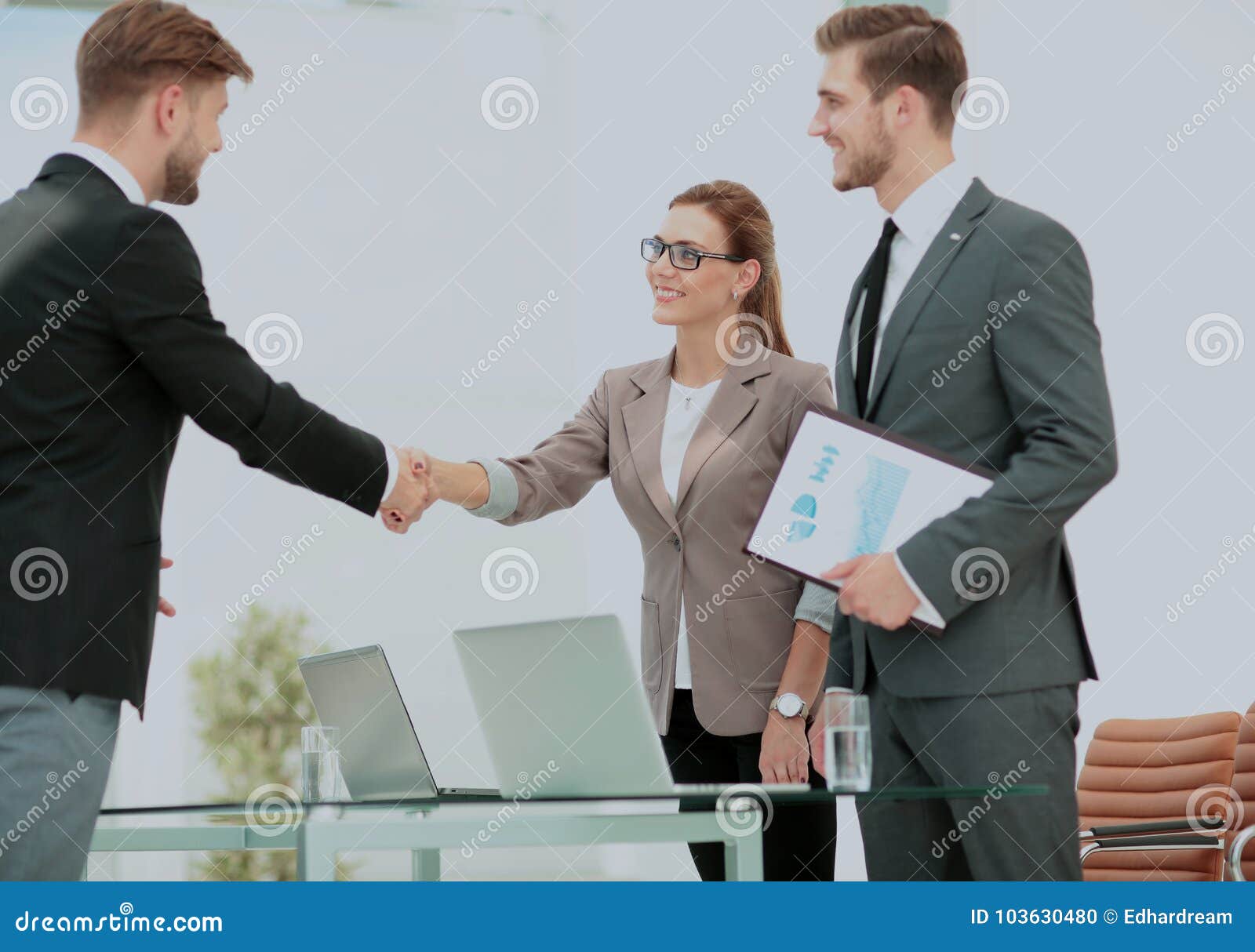 Business People Shaking Hands in an Office Stock Photo - Image of ...