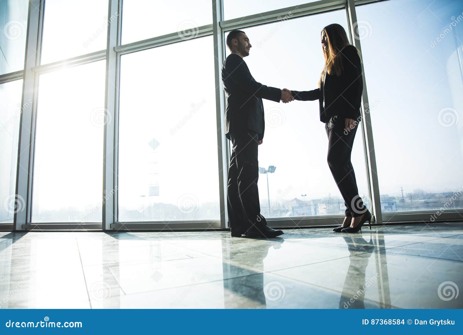 Business People Shaking Hands Over Office Background Stock Photo ...