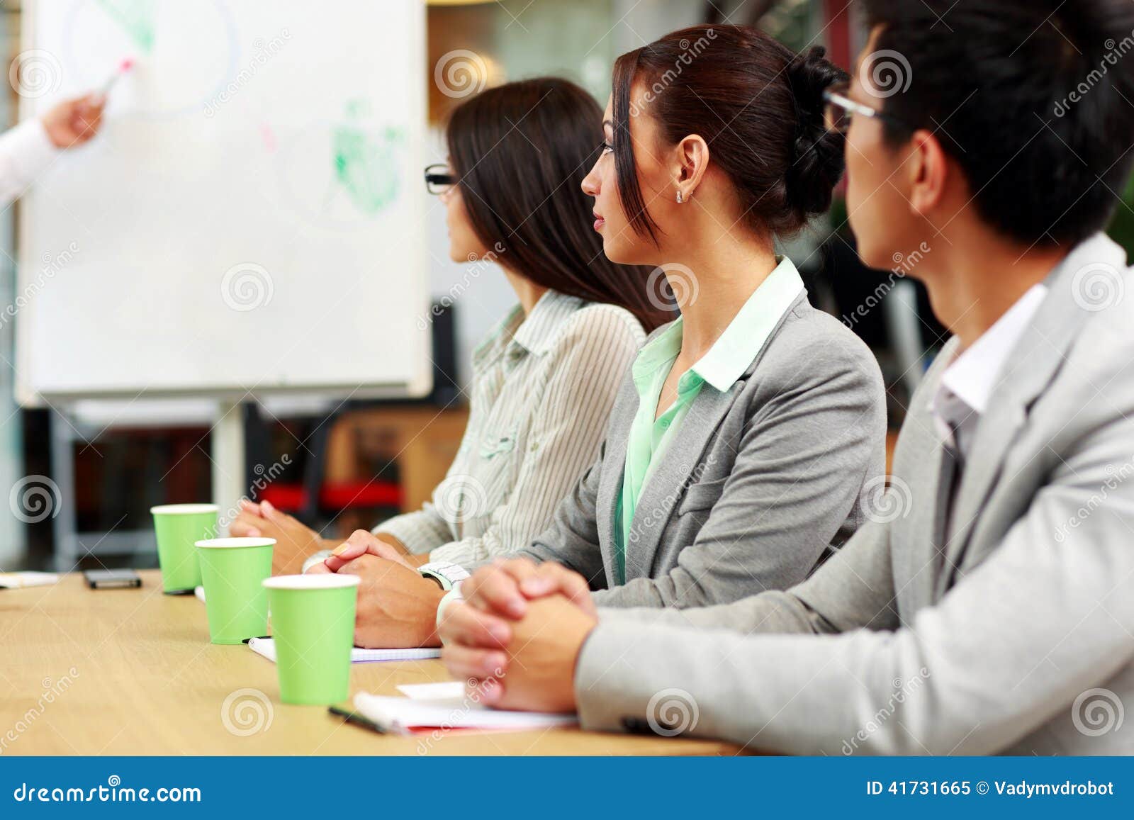 Business People Sitting Around a Table during a Meeting Stock Image ...
