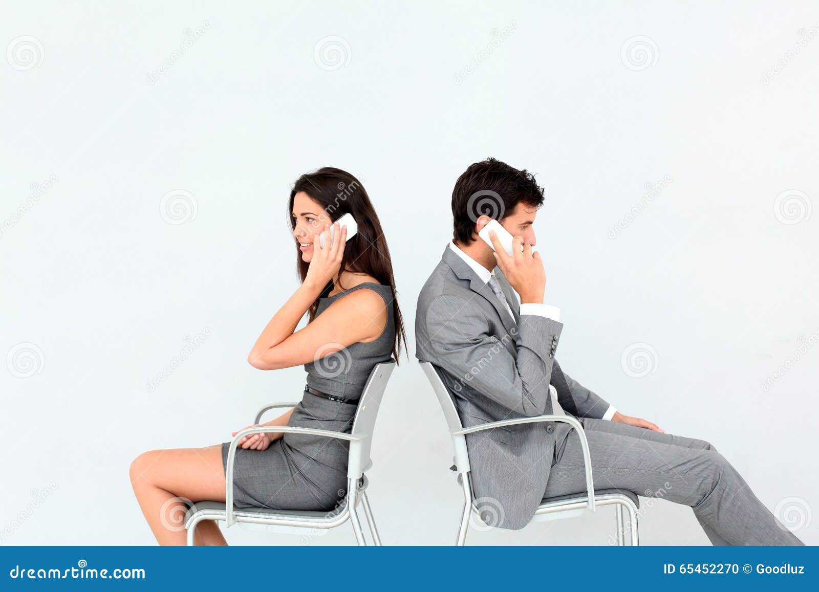 Business People Sitting Back To Back Talking on the Phone Stock Photo ...