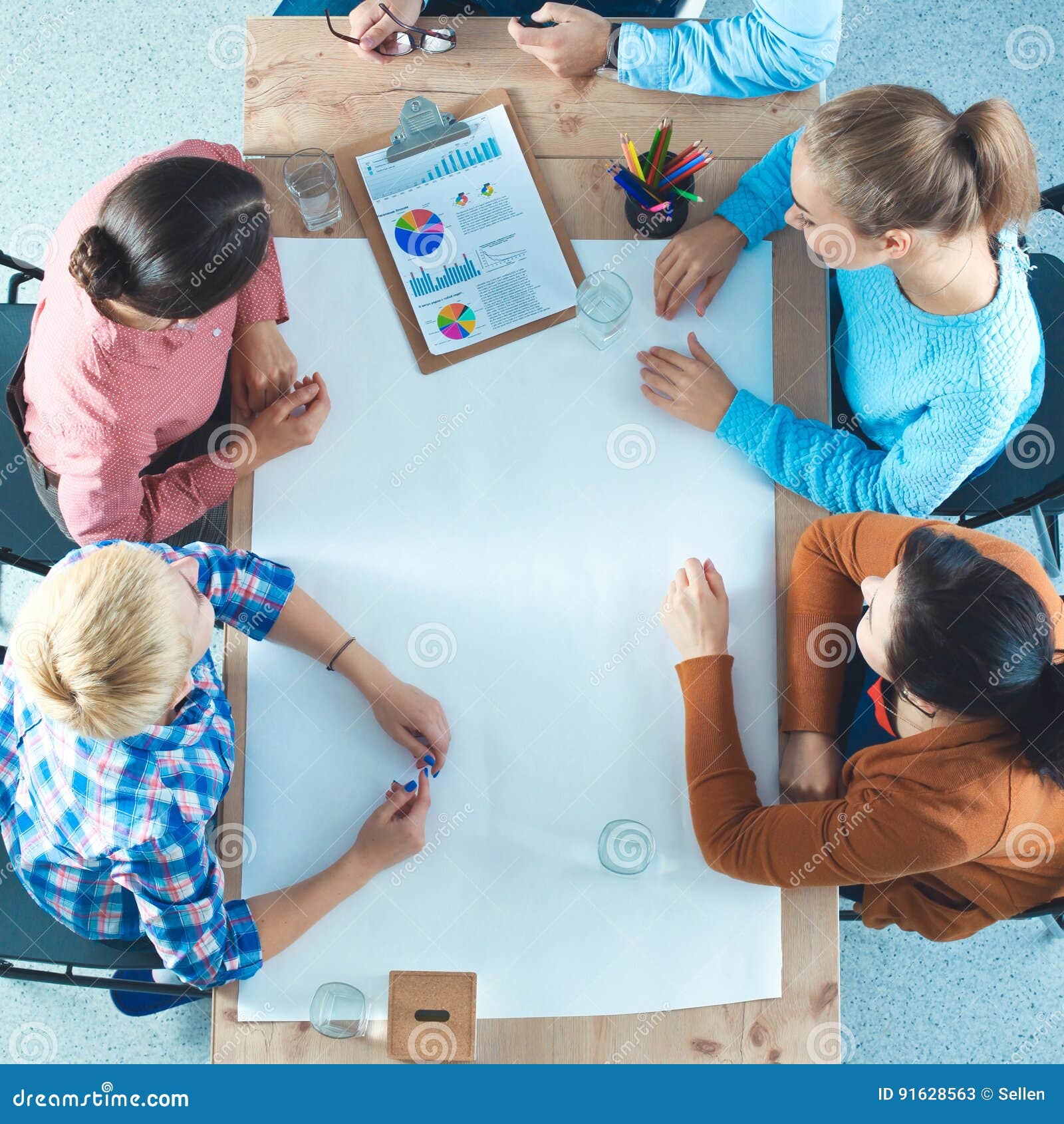 Business People Sitting and Discussing at Business Meeting, in Office ... Business People Sitting and Discussing at Business Meeting, in Office ...