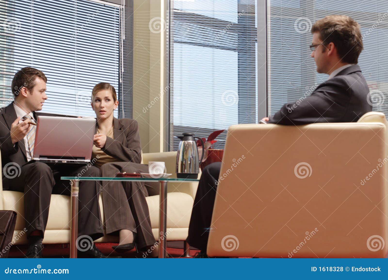 Business People Sitting in the Office and Talking Stock Photo - Image ...