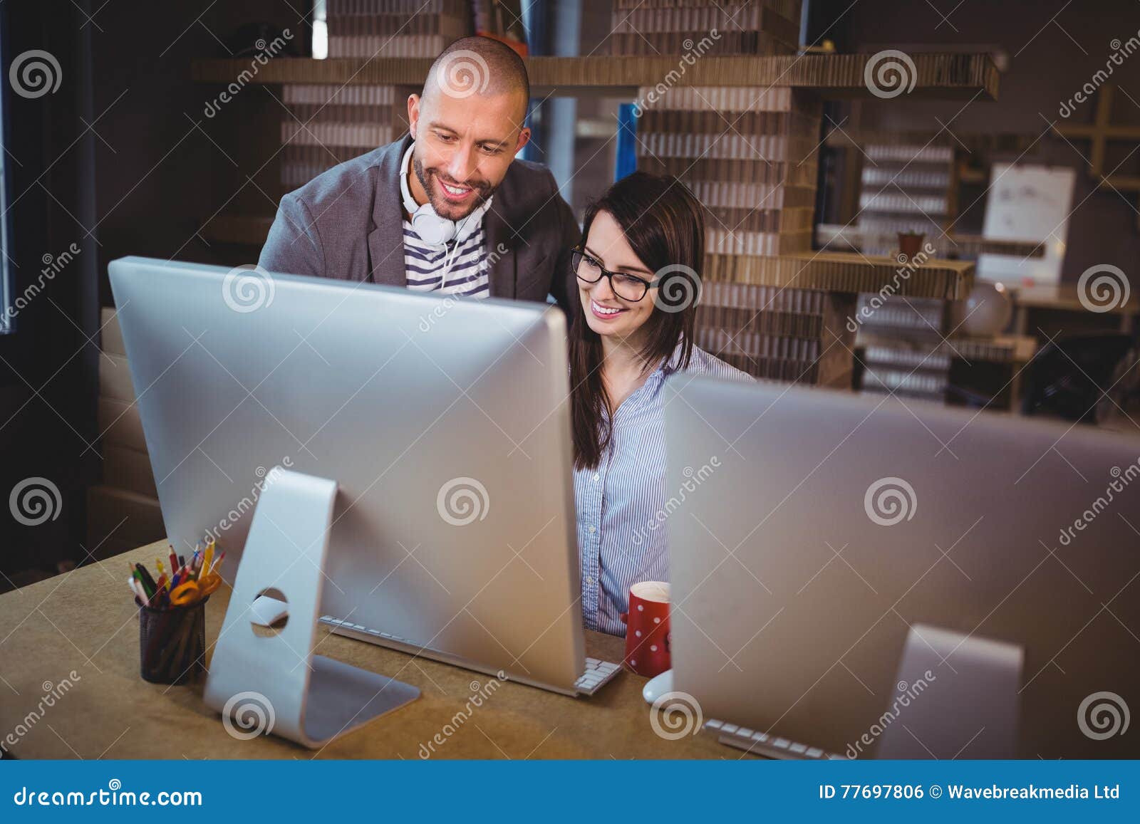 Business People Smiling while Looking at Computer Stock Photo - Image ...