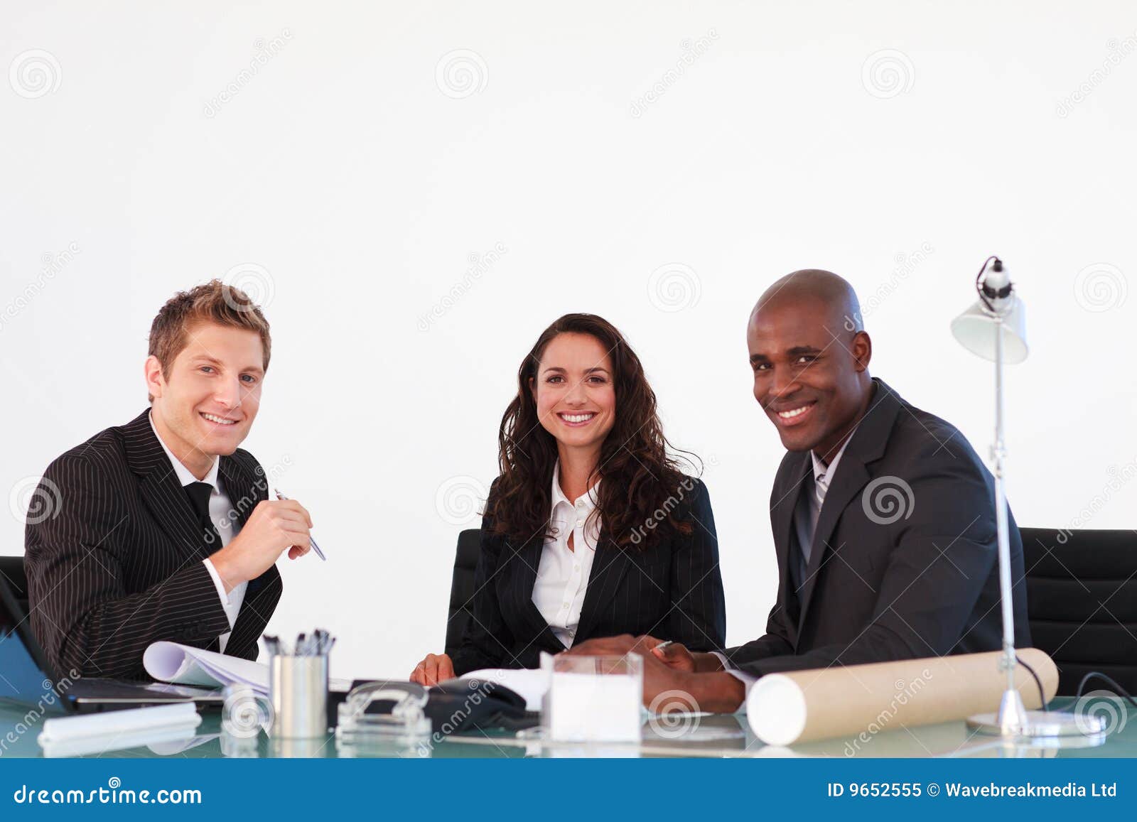 Business People Smiling To the Camera in a Meeting Stock Image - Image ...