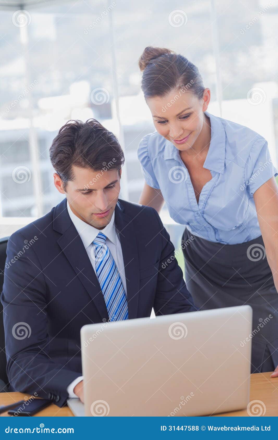 Business People Smiling and Working Together with a Laptop Stock Photo ...