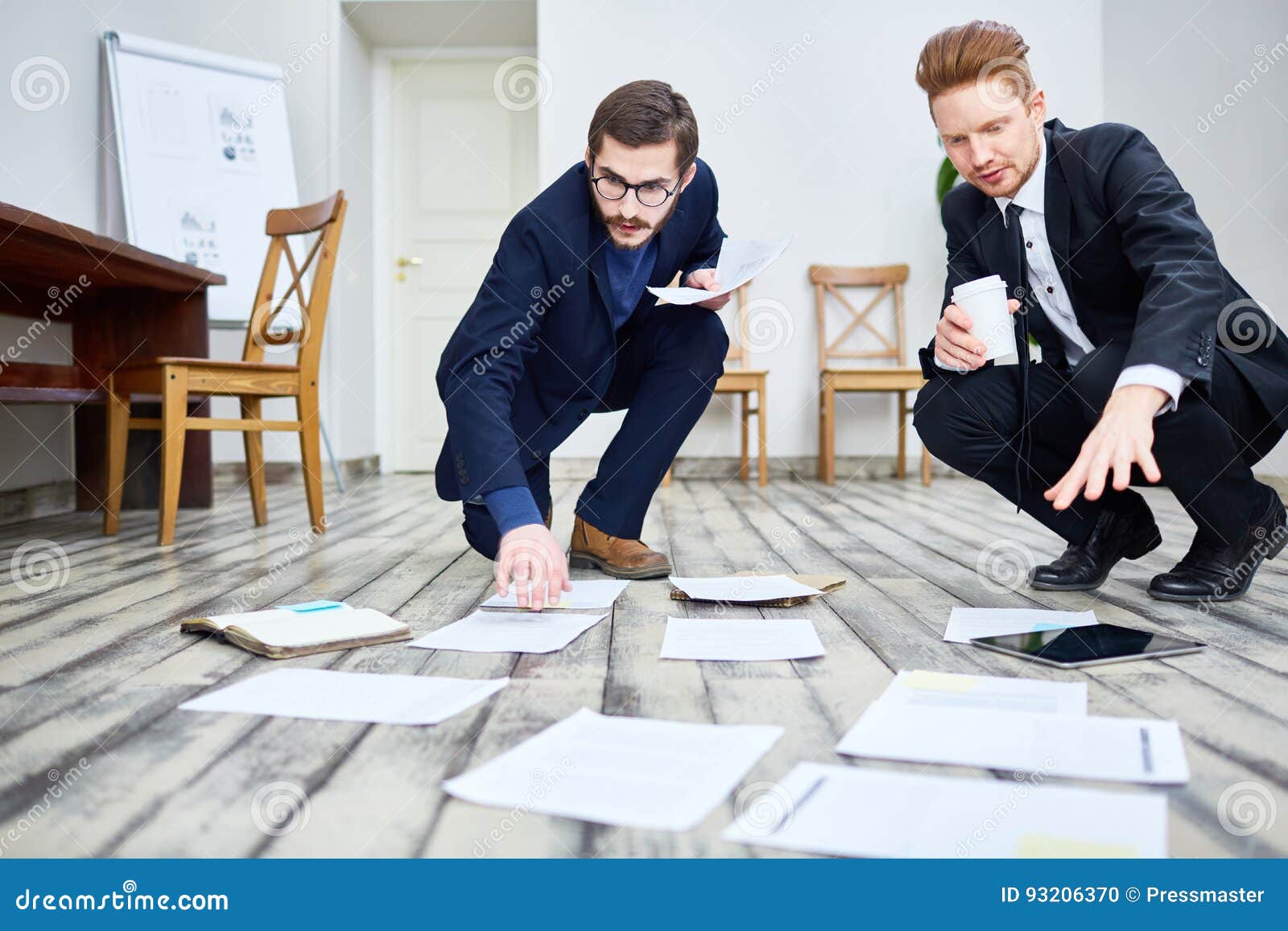 Business People Sorting Documentation on Floor Stock Photo - Image of ...