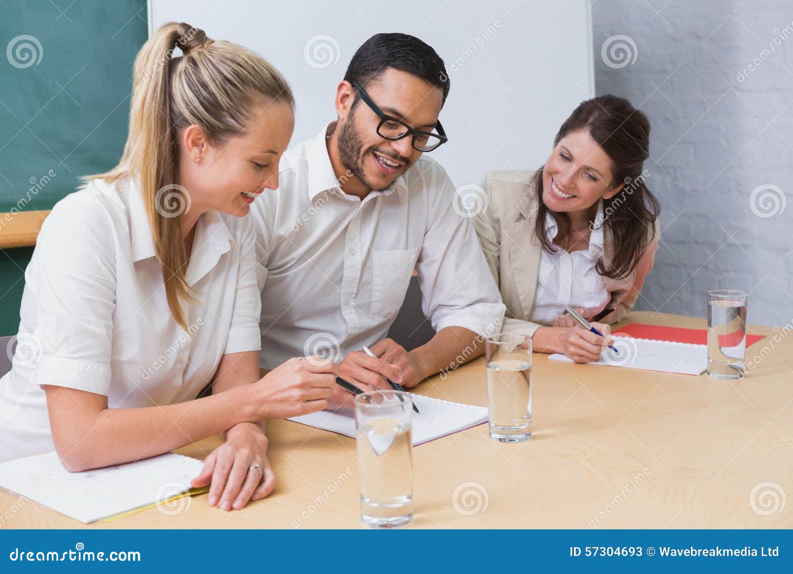 Business People Speaking about Notes that they Took Stock Image - Image ...