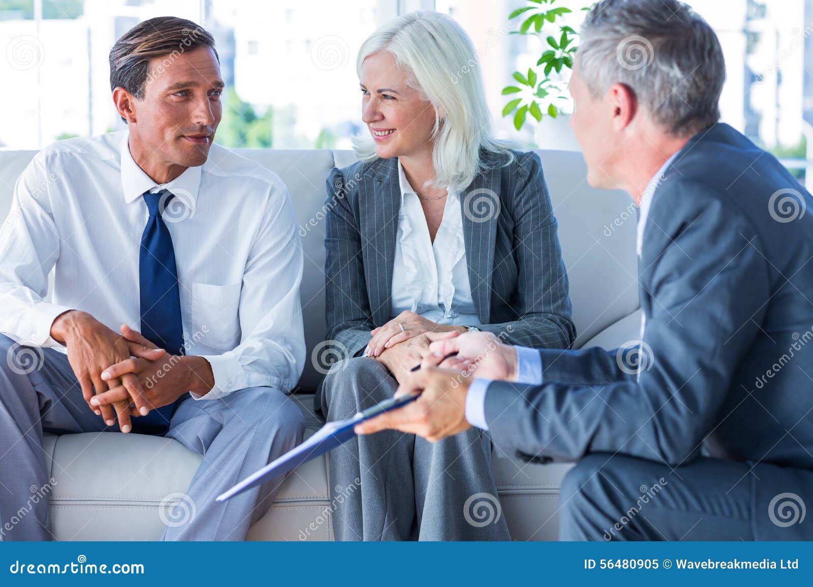 Business People Speaking Together on Couch Stock Image - Image of ...
