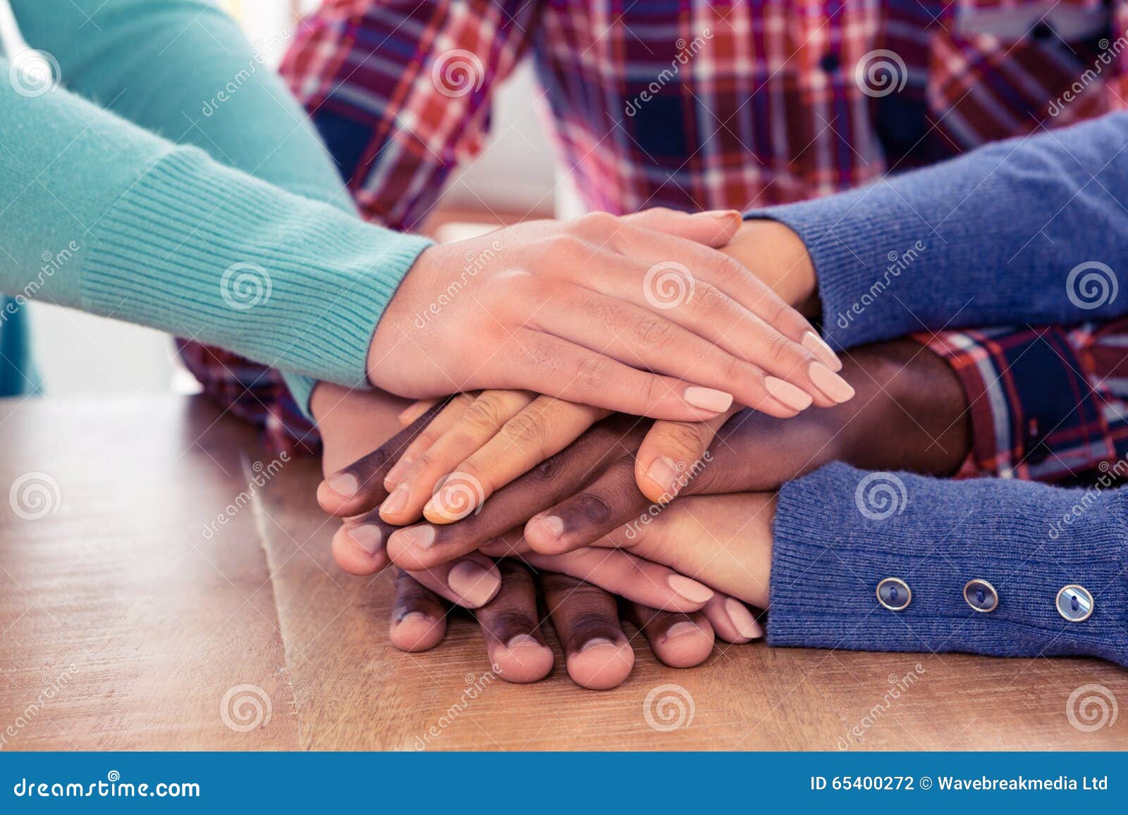Business People with Stacked Hands on Desk Stock Photo - Image of ...