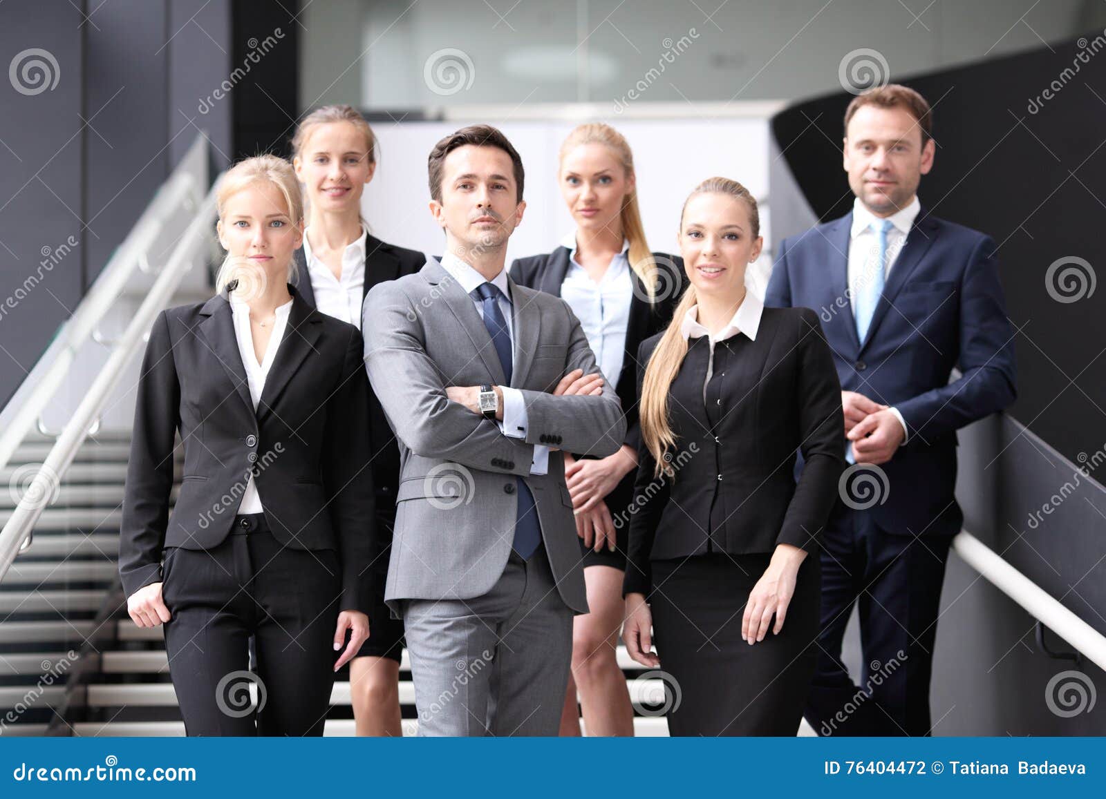 Business people on stairs stock photo. Image of portrait - 76404472
