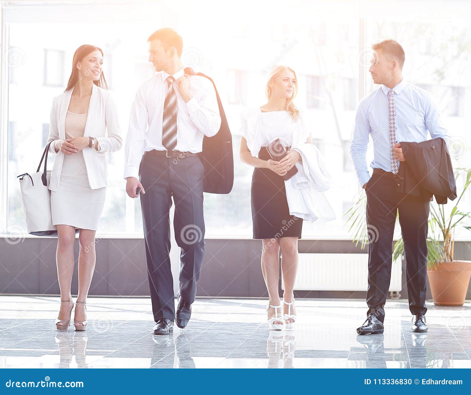 Business People Standing in the Lobby of the Modern Office. Stock Photo ...