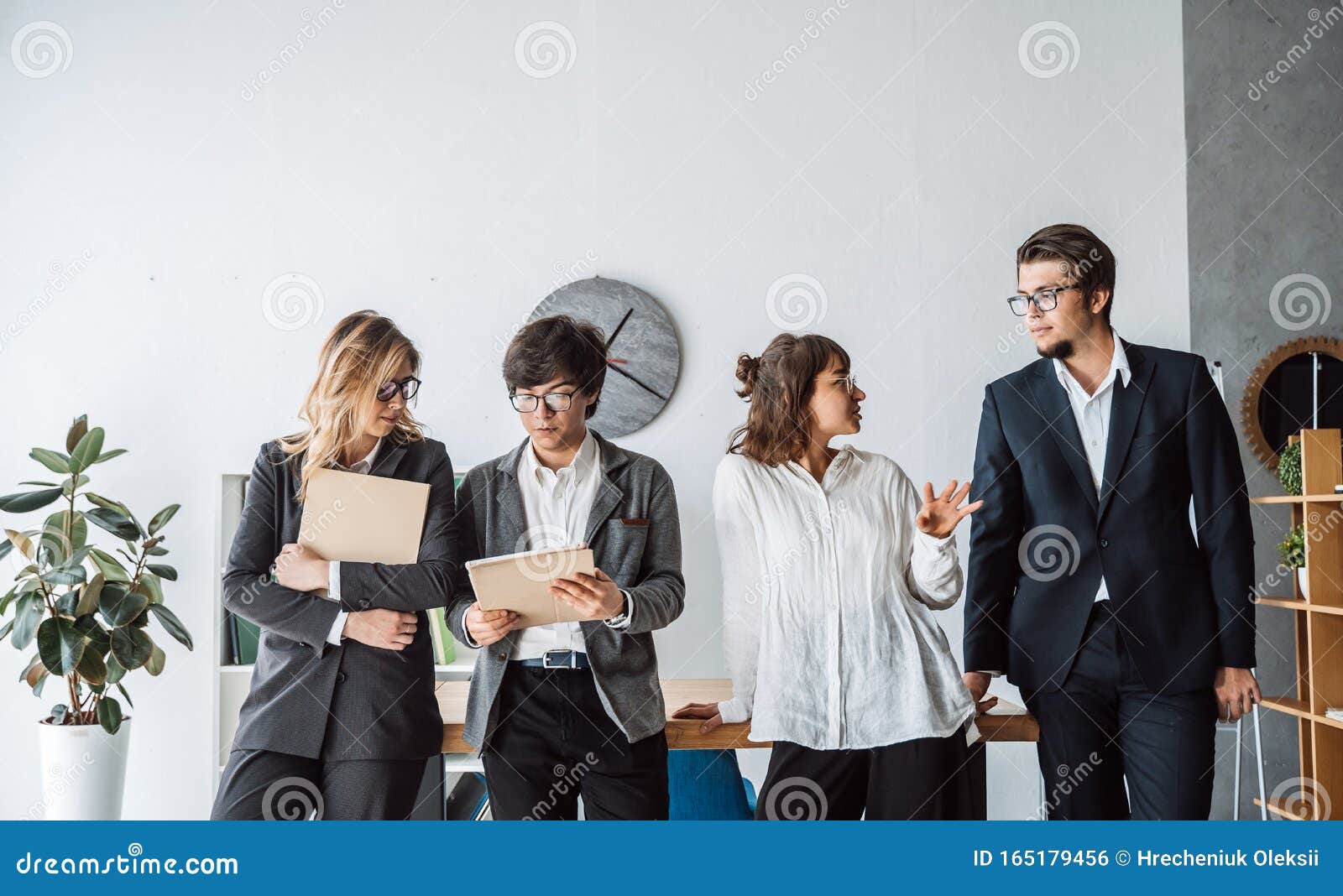 Business People Standing in the Office Discuss Stock Photo - Image of ...