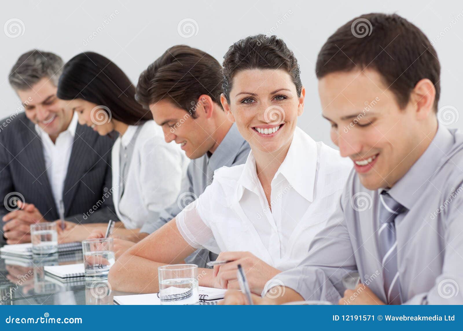 Business People Taking Notes in a Meeting Stock Image - Image of ...