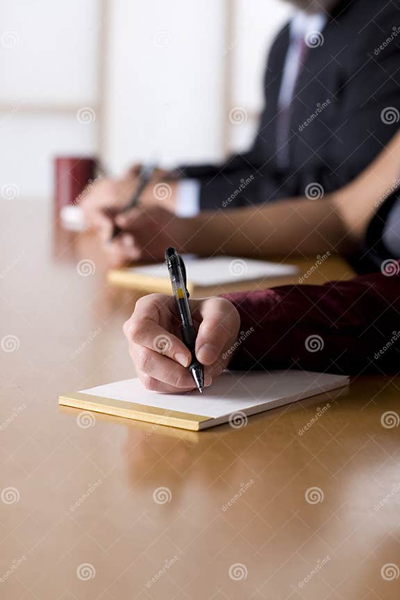 Business People Taking Notes in a Meeting Stock Photo - Image of notes ...