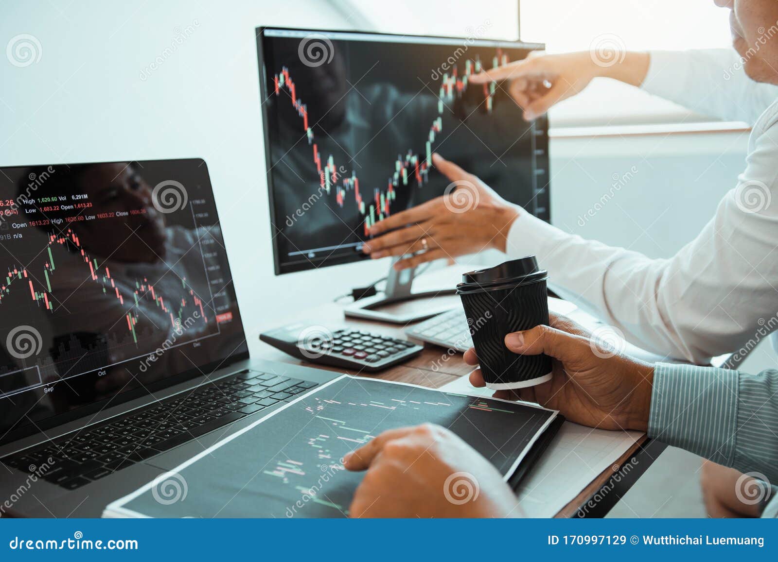 Business People Talking and Analysis with Profit from the Screen Stock ...