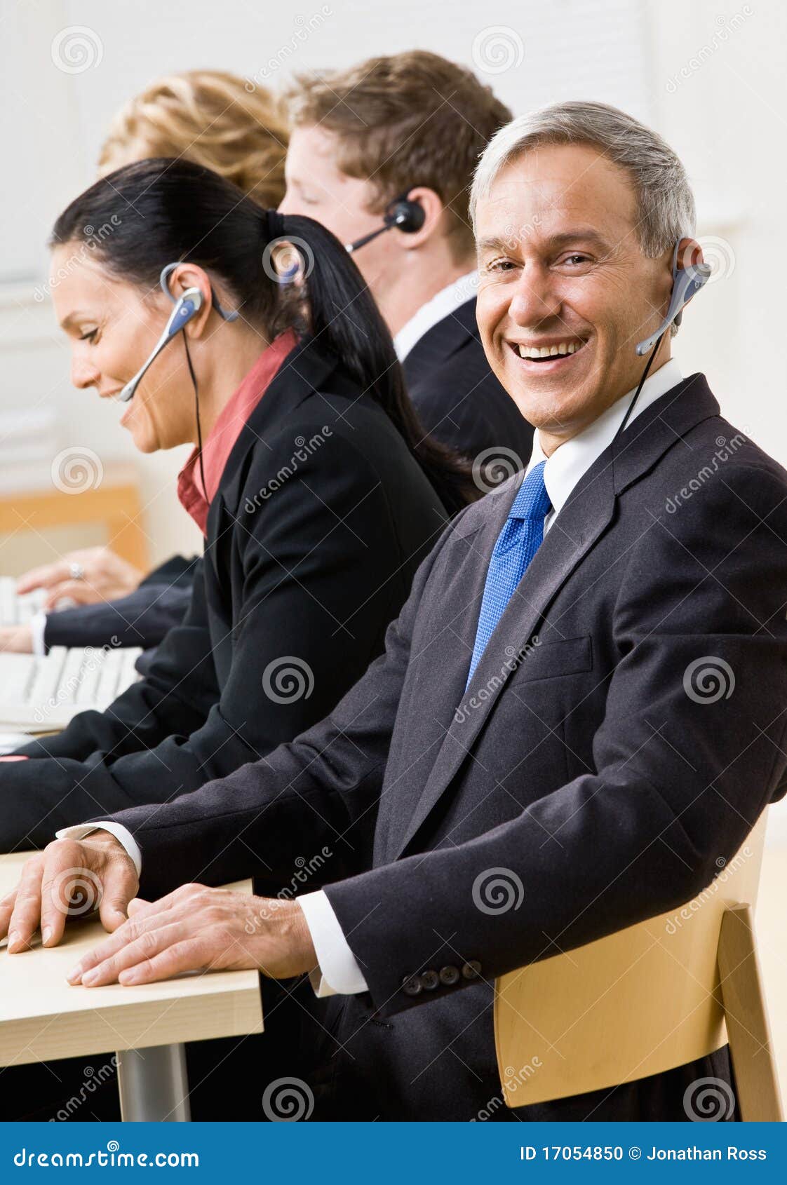 Business People Talking on Headsets Stock Photo - Image of male ...
