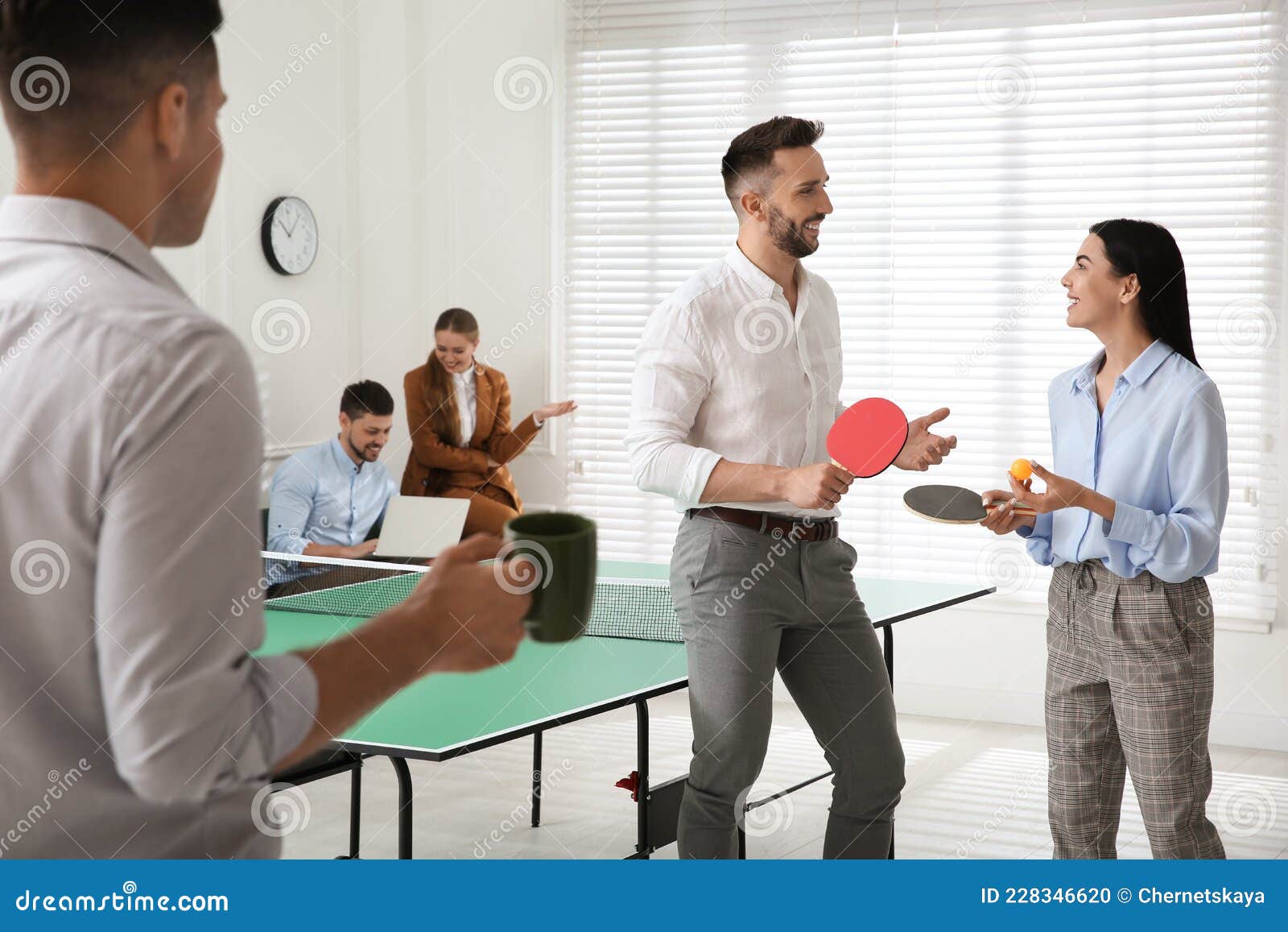 Business People Talking Near Ping Pong Table in Office Stock Photo ...