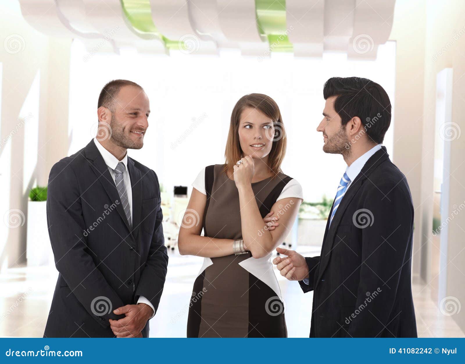 Business People Talking in Office Corridor Stock Photo - Image of ...