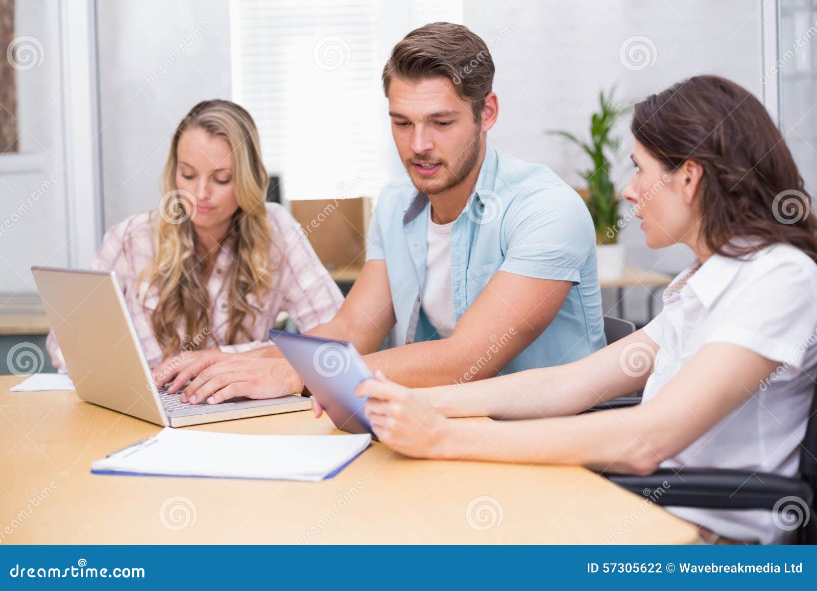 Business People Using Digital Tablet and Laptop in Meeting Stock Photo ...