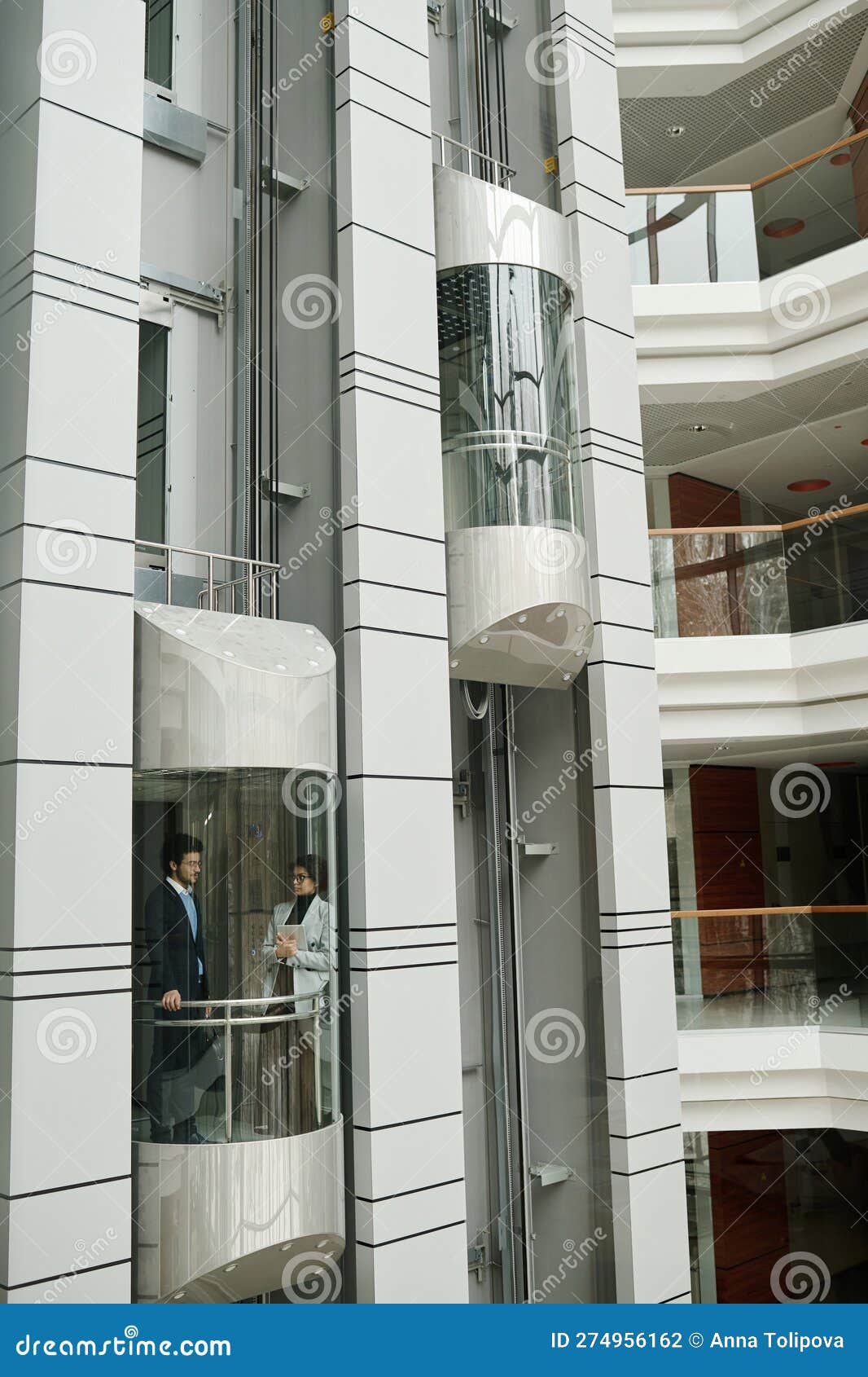 Business People Using Elevator in Office Centre Stock Photo - Image of ...