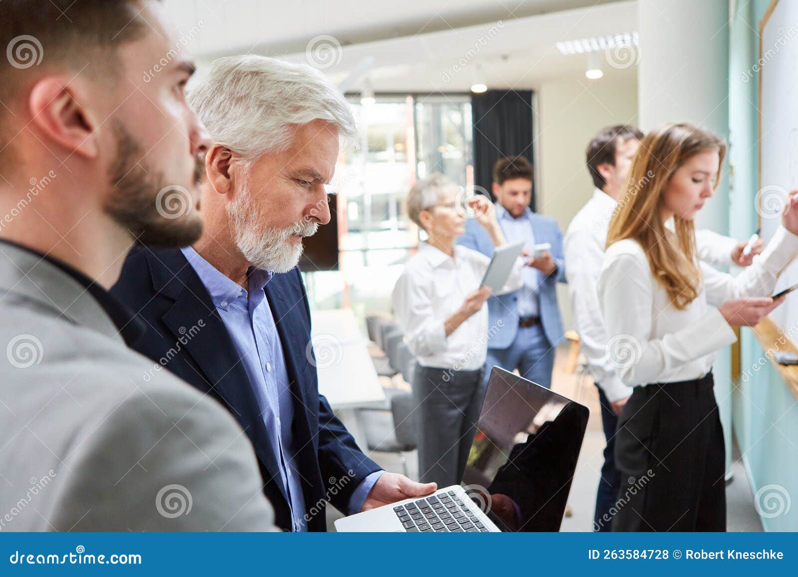 Business People Using Laptop in Brainstorming Workshop Stock Photo ...