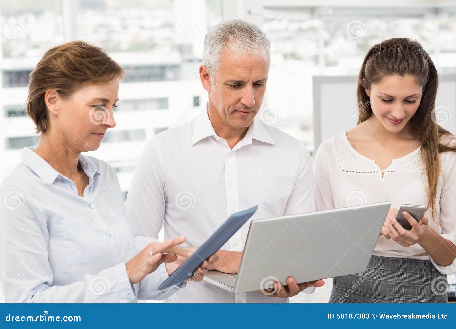 Business People Using Several Electronic Devices Stock Image - Image of ...