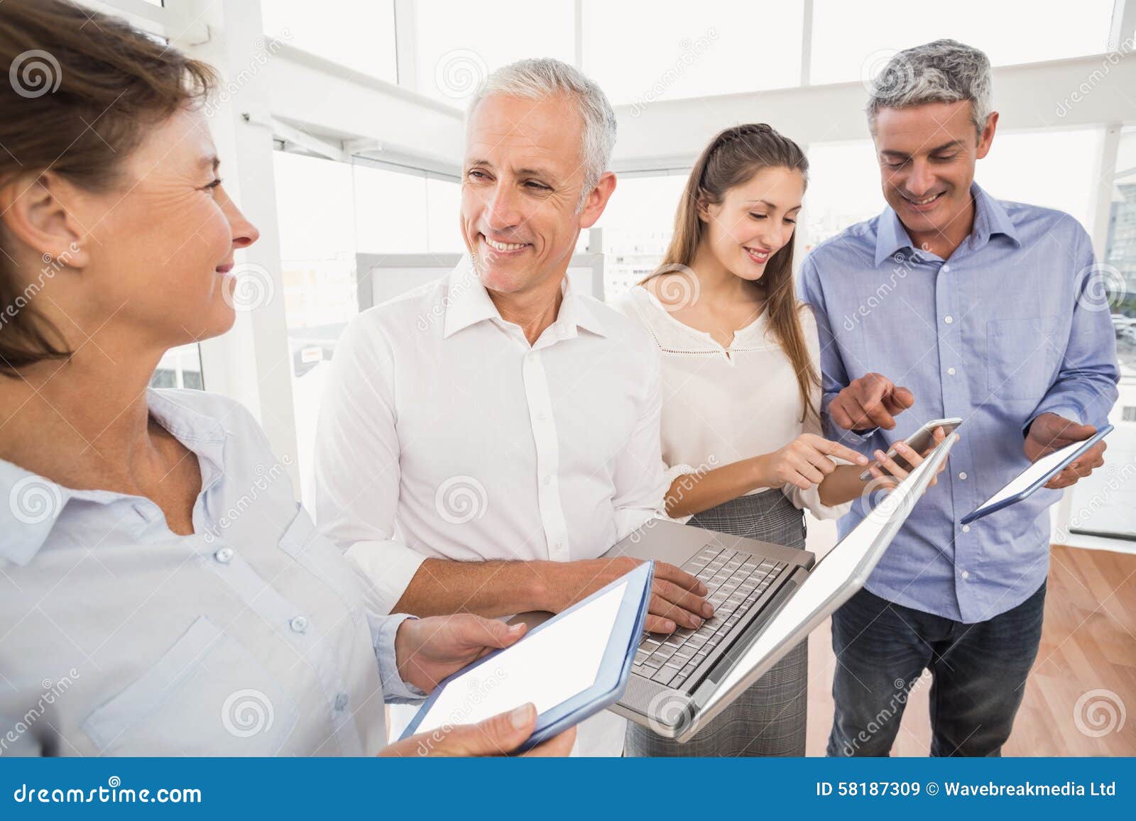Business People Using Several Electronic Devices Stock Image - Image of ...
