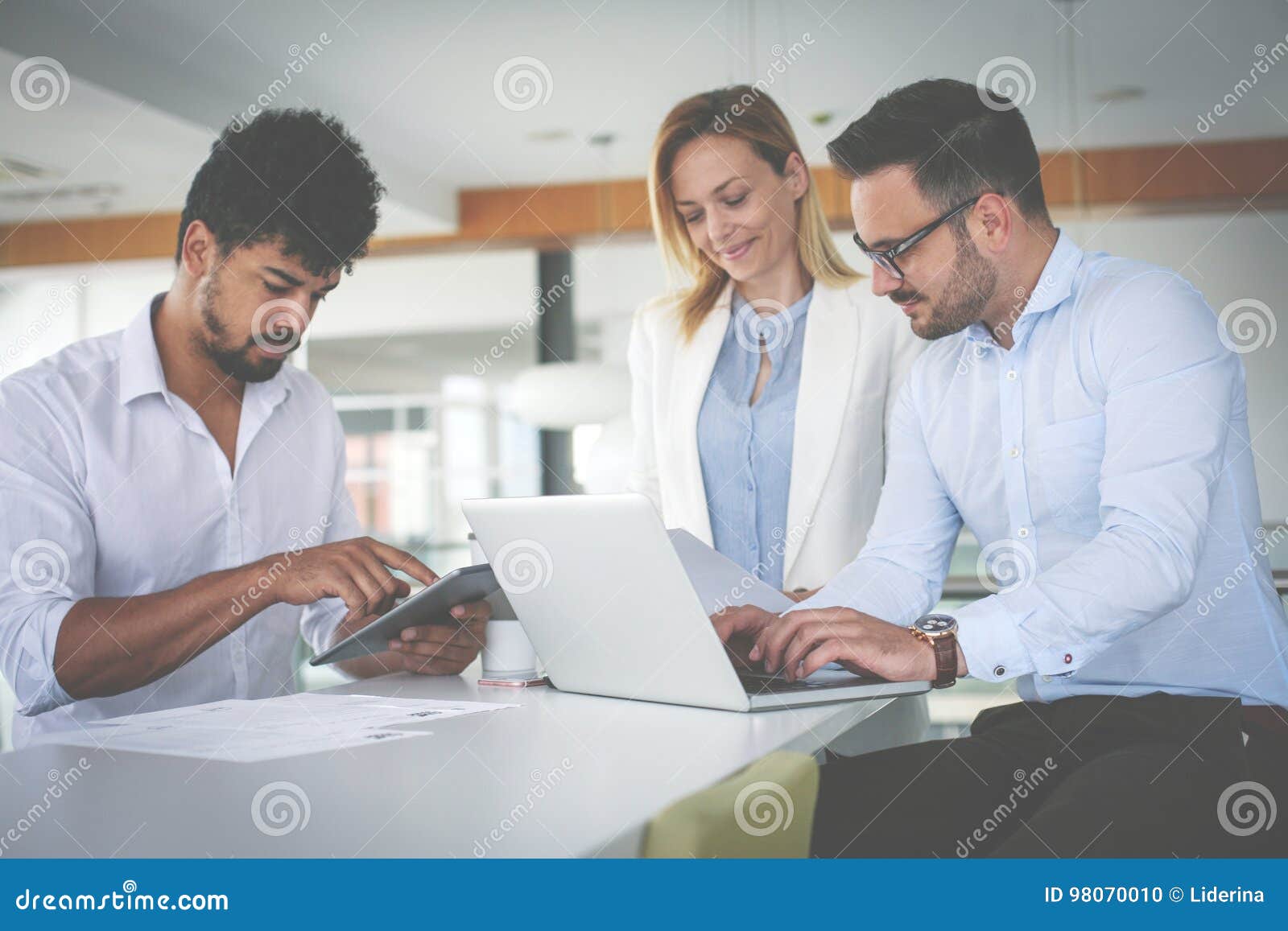 Business People Using Technology and Checking Document. Stock Photo ...