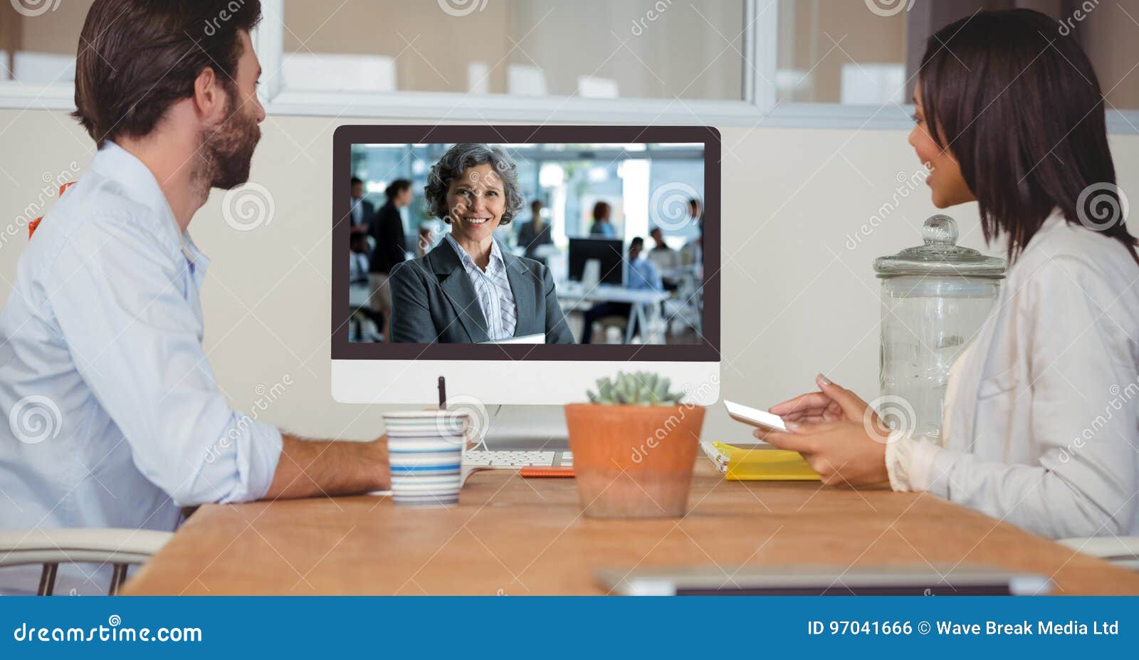 Business People Video Conferencing with Colleague on Computer Stock ...