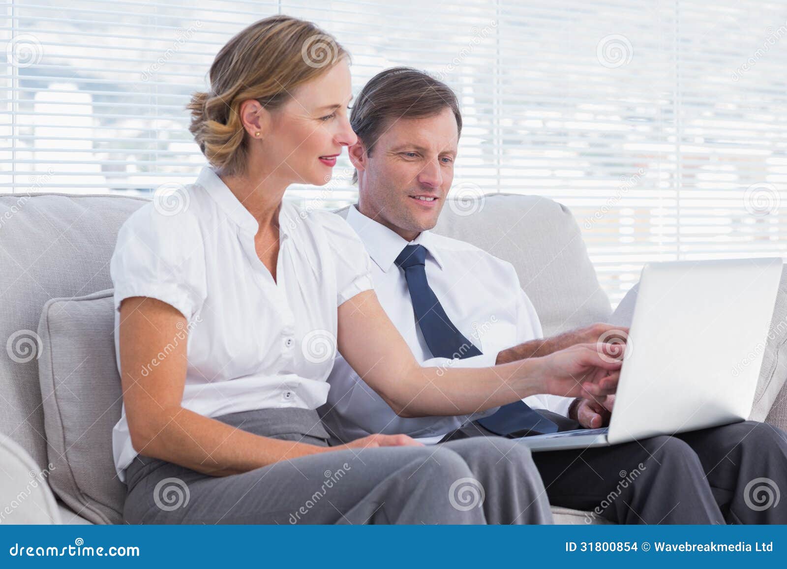 Business People Watching Something on Laptop Stock Photo - Image of ...