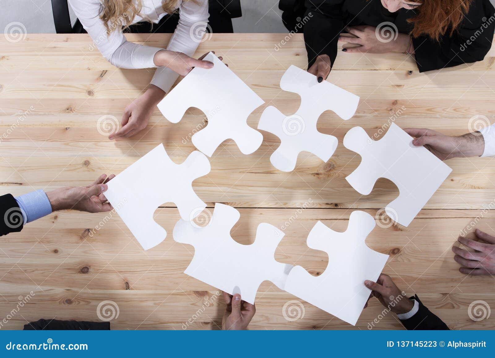 Business People Work Together To Build a Puzzle. Concept of Teamwork ... Business People Work Together To Build a Puzzle. Concept of Teamwork ...