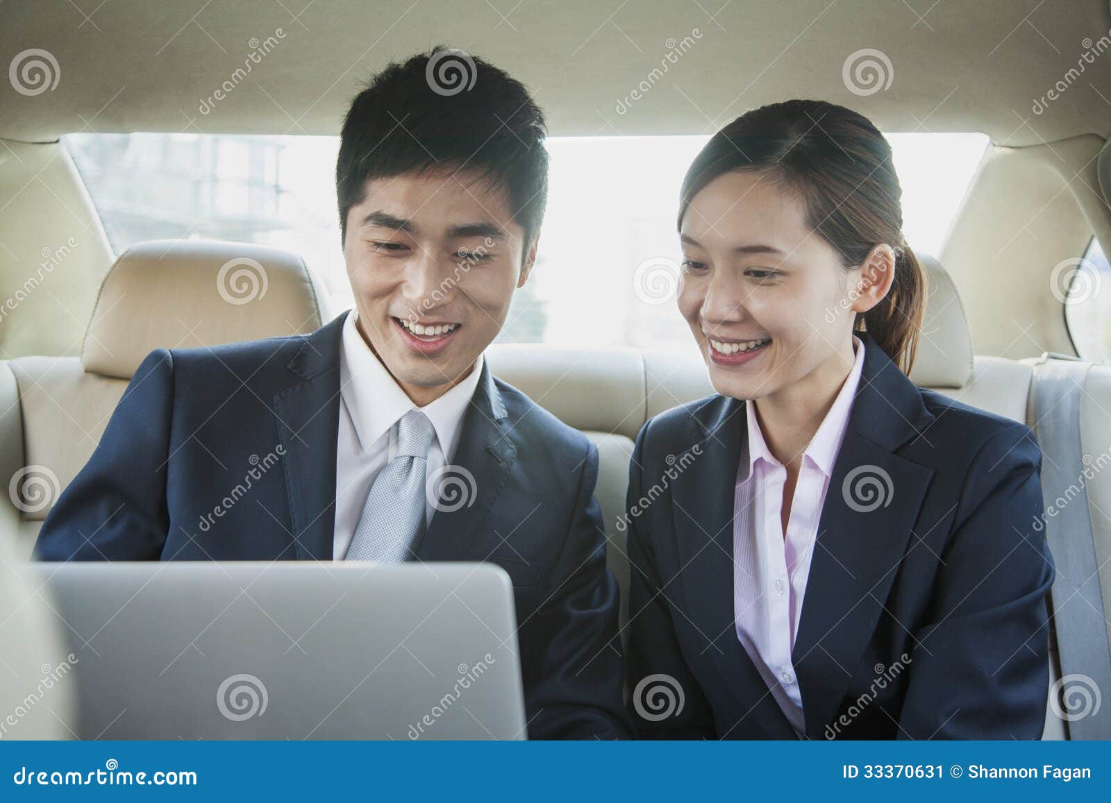 Business People Working in Back Seat of Car Stock Image - Image of ...