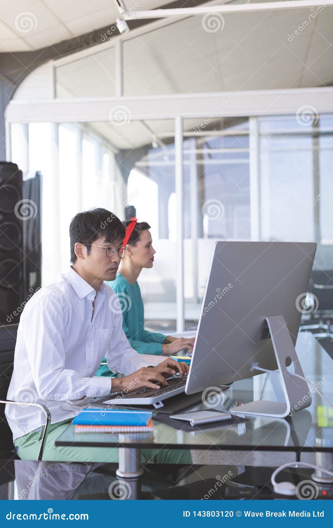 Business People Working on Computer at Desk in Office Stock Photo ...