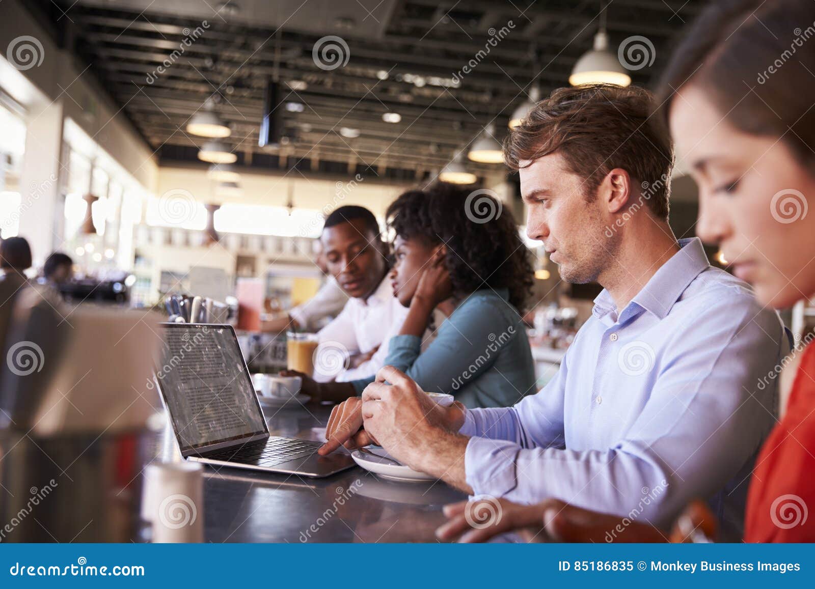 Business People Working at Counter in Coffee Shop Stock Image - Image ...