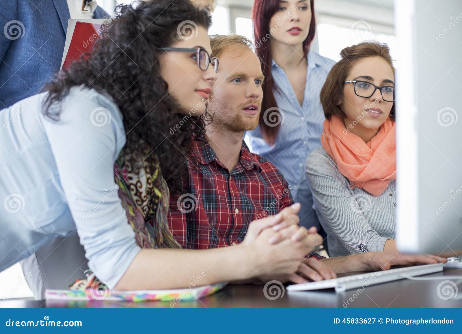 Business People Working Together on Computer in Office Stock Image ...