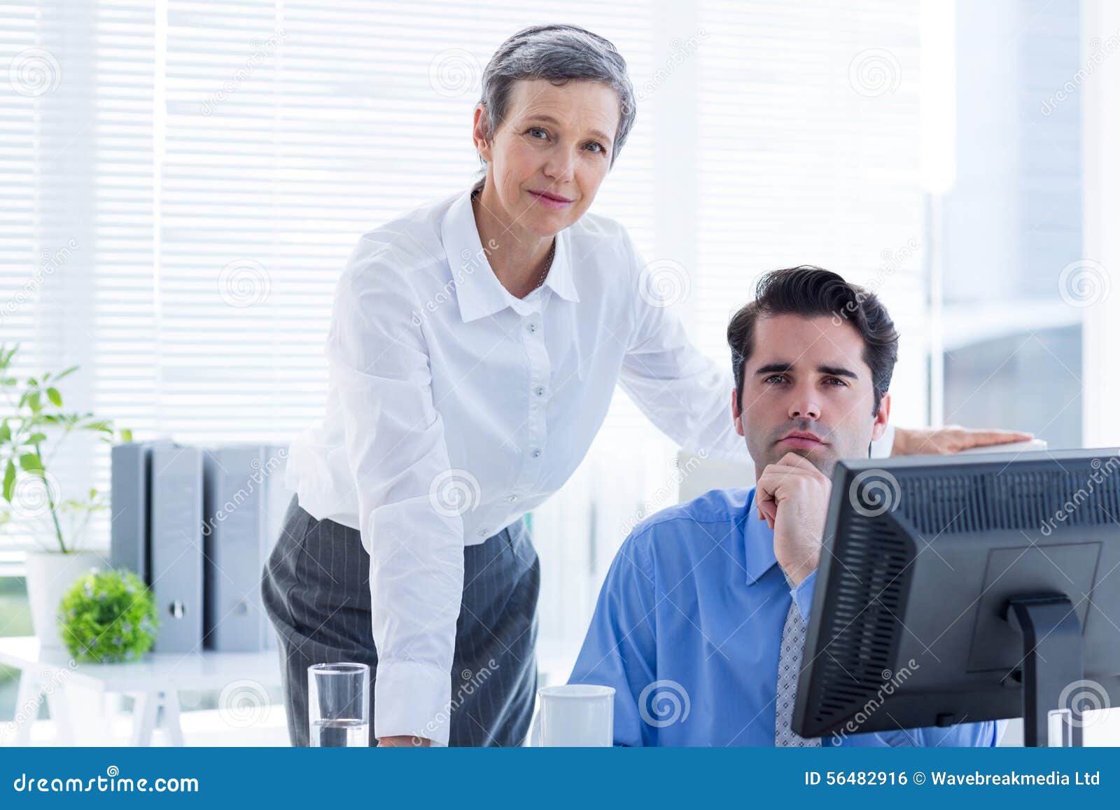 Business People Working Together and Looking at Camera Stock Photo ...