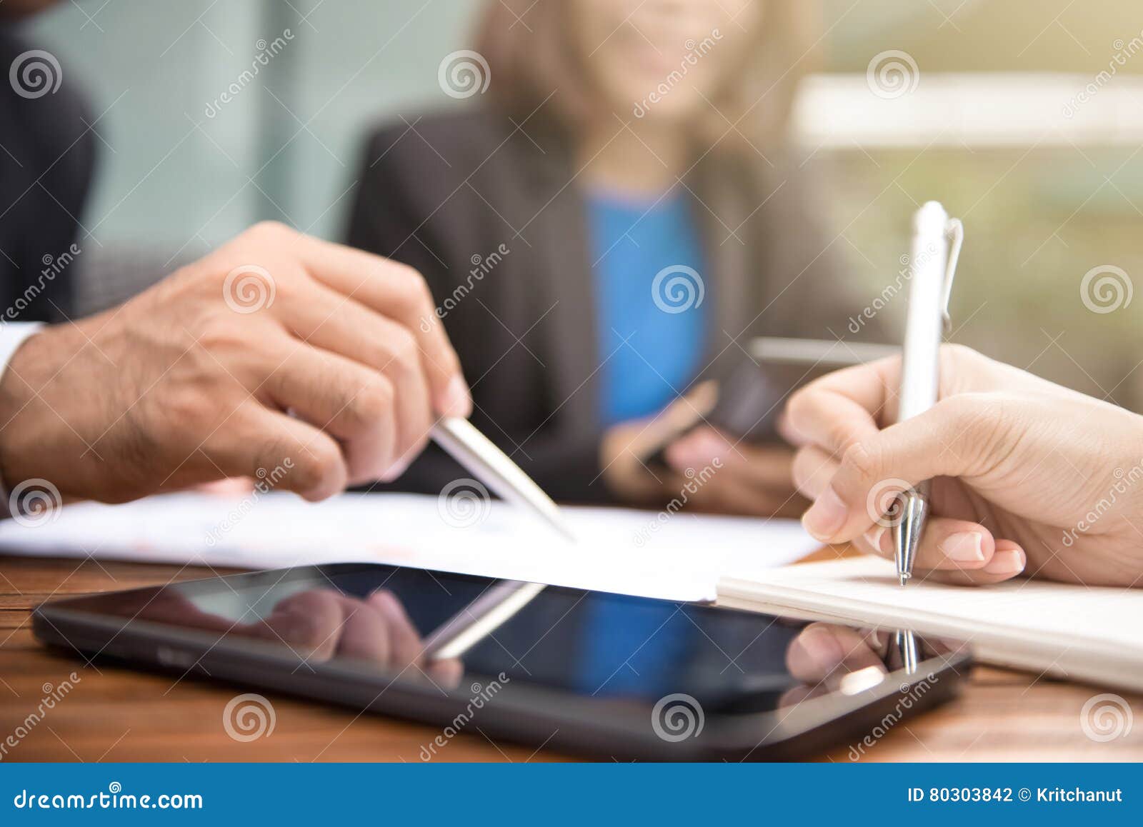 Business People Writing and Discussing Documents Stock Photo - Image of ...