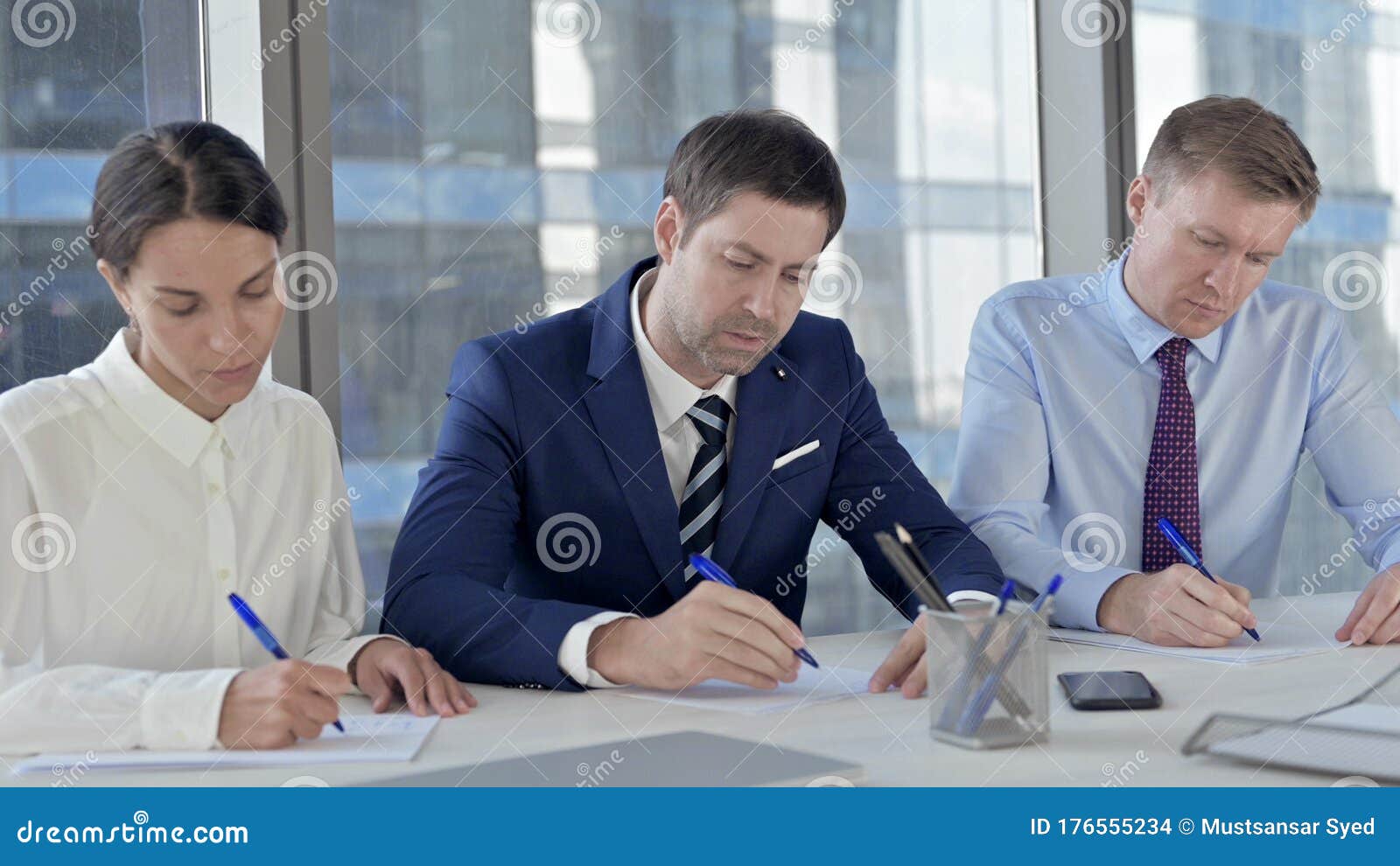Business People Writing Documents on Office Table Stock Photo - Image ...