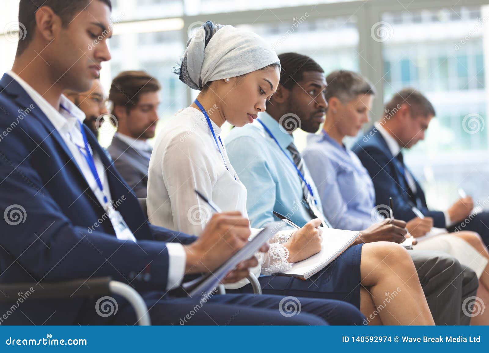 Business People Writing on Notepad during Seminar Stock Photo - Image ...