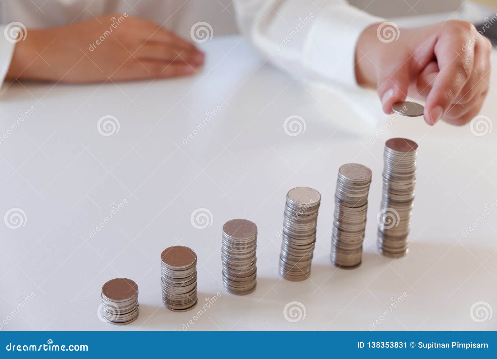 Business Person Placing Coin Over the Increasing Coins Stack Stock ...