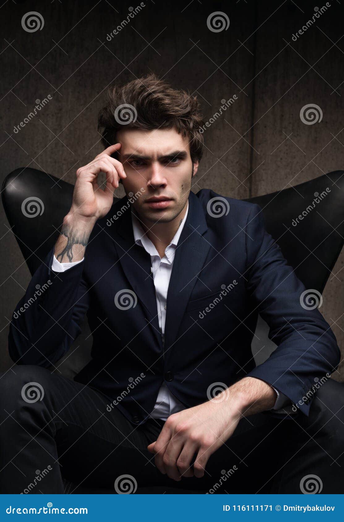 Business Portrait Of A Serious Young Man Sitting In A Chair Stock Image ... Business Portrait Of A Serious Young Man Sitting In A Chair Stock Image ...