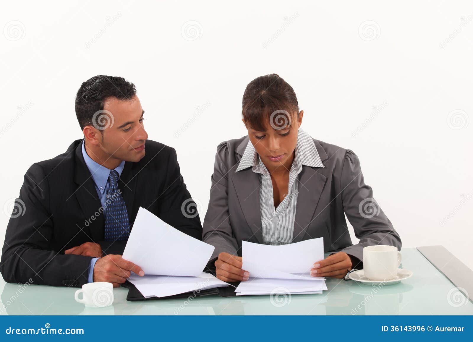 Business Professionals Reviewing Reports Stock Photo - Image of office ...