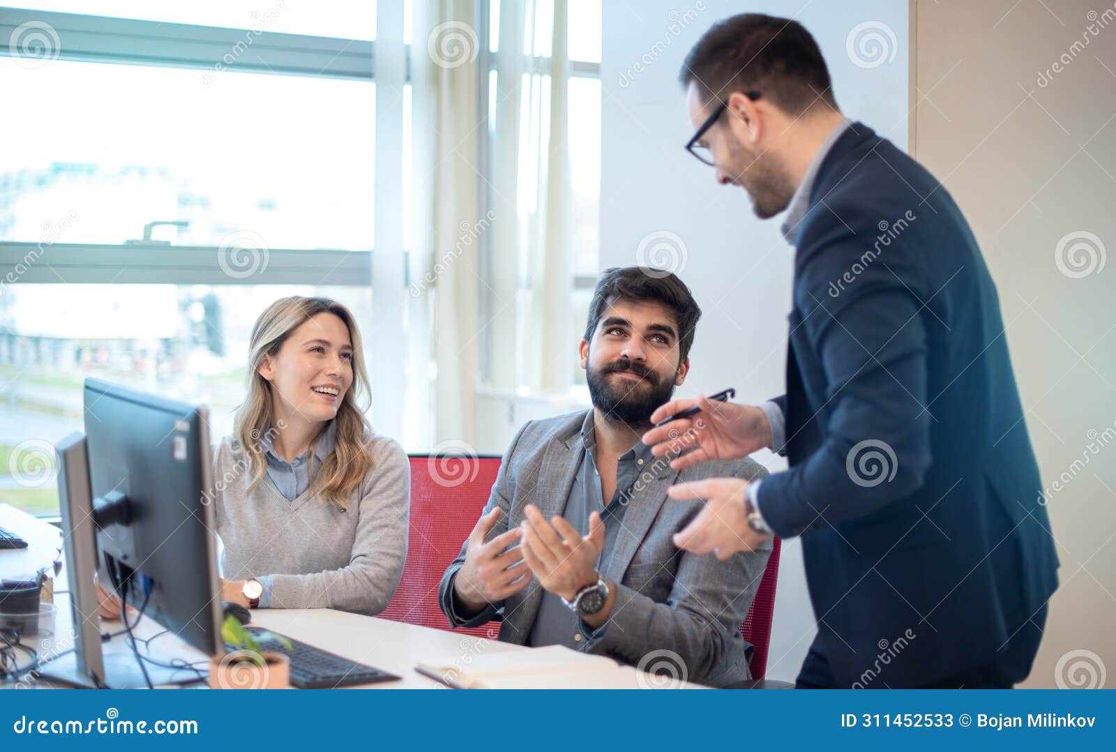 Business Professionals Talking To Each Other at Office Table, Speaking ...