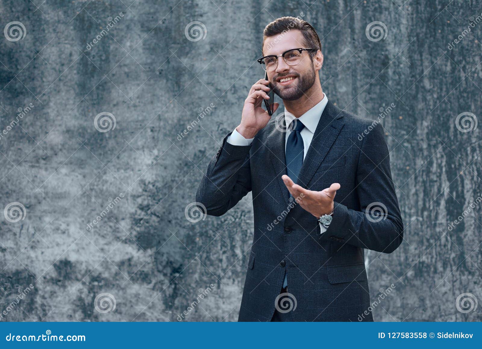 Business Talk. Handsome Young Man in Full Suit Talking on the Phone ... Business Talk. Handsome Young Man in Full Suit Talking on the Phone ...
