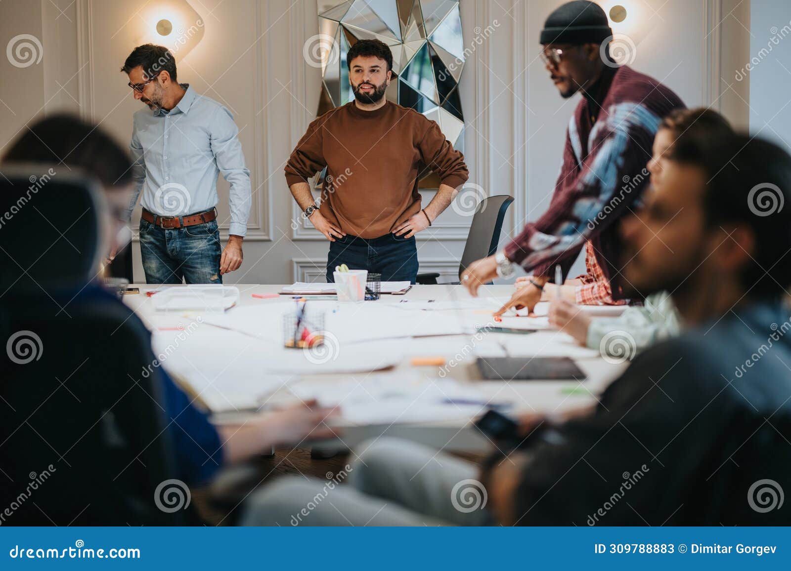 Business Team Actively Engaged in a Workshop, Collaborating Over ...