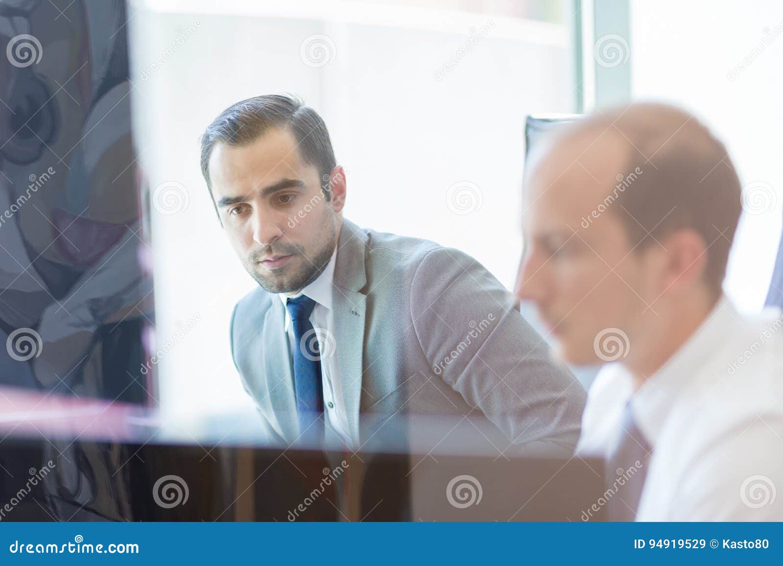 Business Team Analyzing Data at Business Meeting. Stock Image - Image ... Business Team Analyzing Data at Business Meeting. Stock Image - Image ...