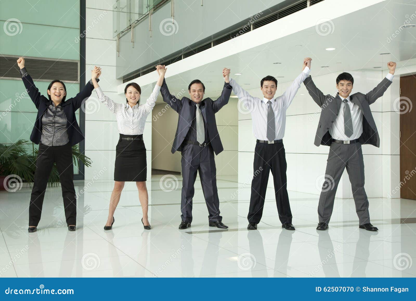 Business Team with Arms Raised Stock Photo - Image of corporate ...